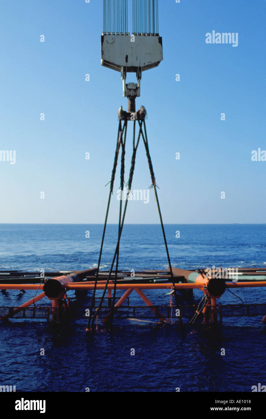 Oil platform jacket being lifted tilted into position by a floating ...