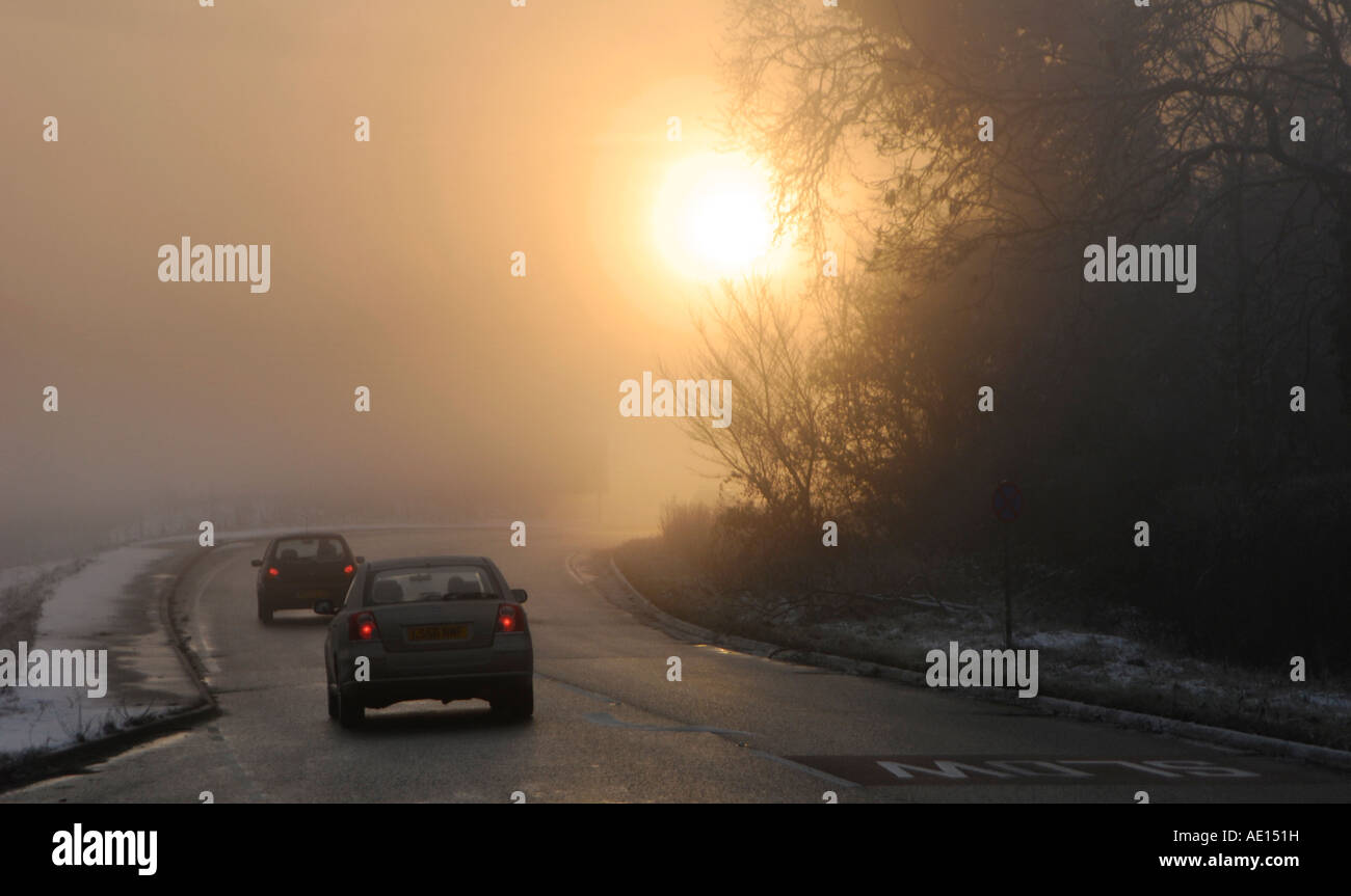 Cars being driven in foggy conditions on a road in the uk Stock Photo ...