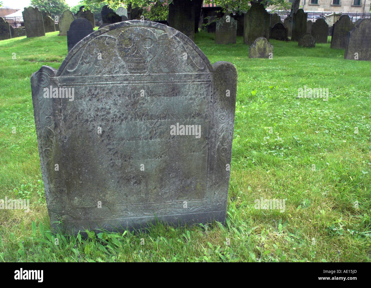 A very old gravestone showing the Deaths Head in the Old Burying Ground ...