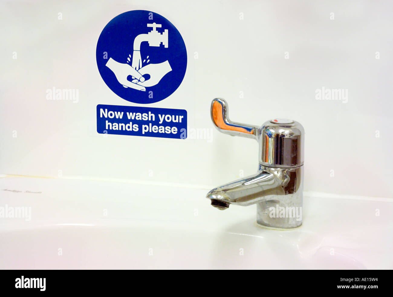 Tap and wash hands sign in hospital Stock Photo - Alamy