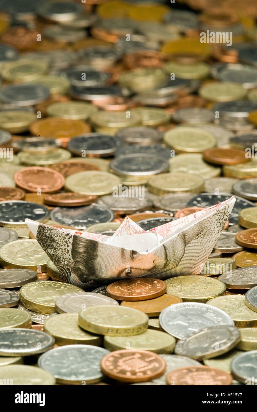 £50 50 pound note paper boat floating on a sea of English British UK ...
