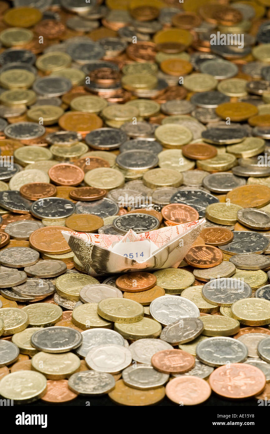 £50 50 pound note paper boat floating on a sea of English British UK ...