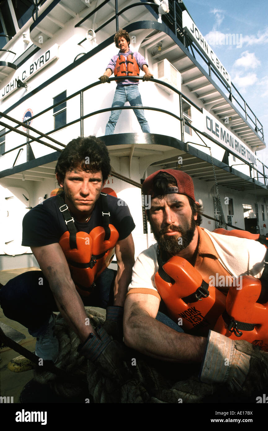 two workers on a barge Stock Photo - Alamy