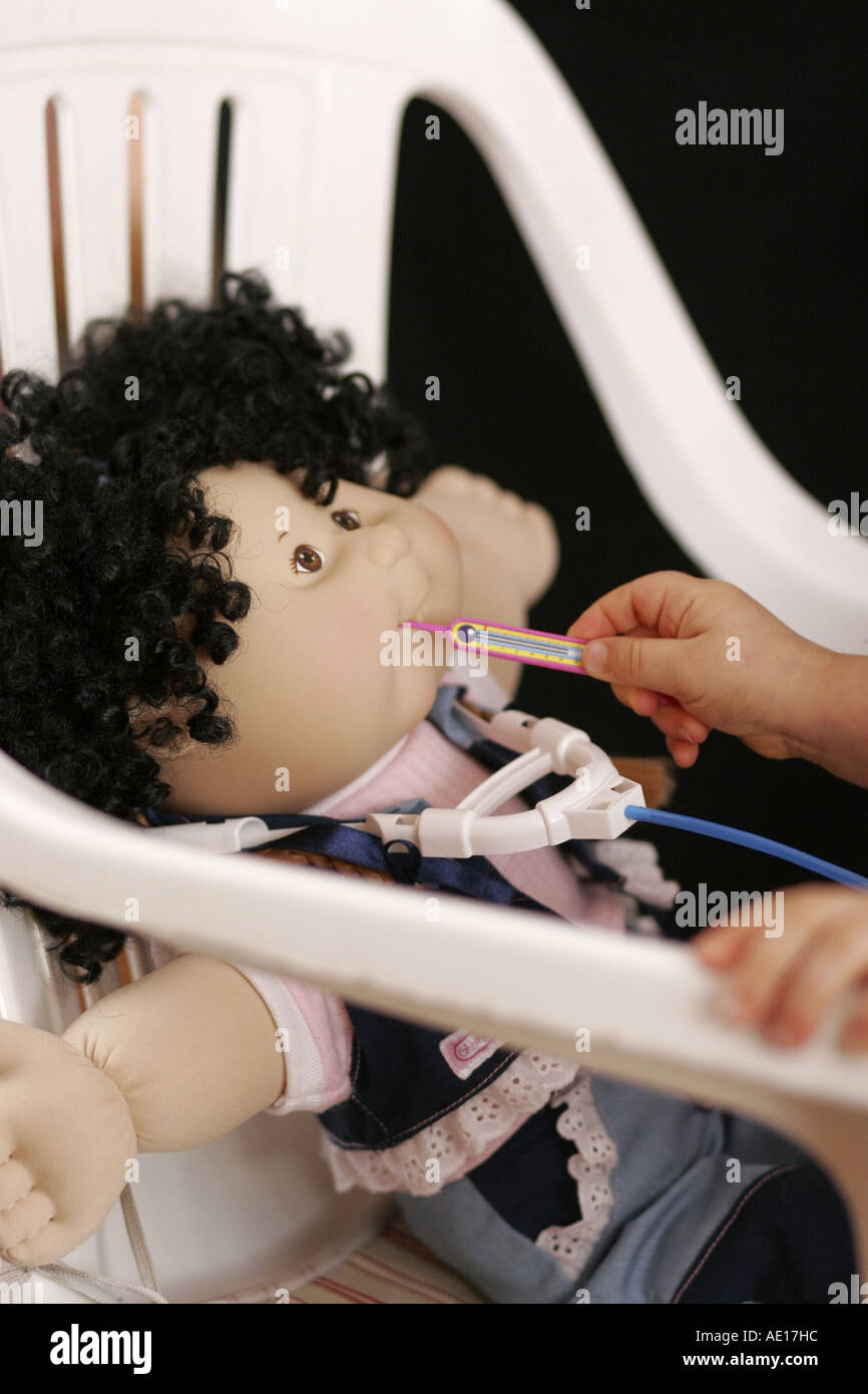 Little girl playing doctor Stock Photo - Alamy