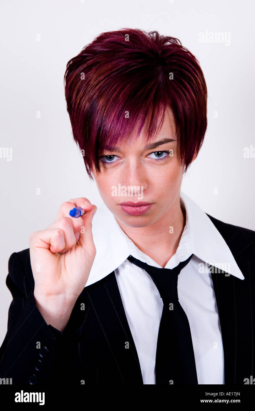 Angry business woman pointing pen hi-res stock photography and images ...
