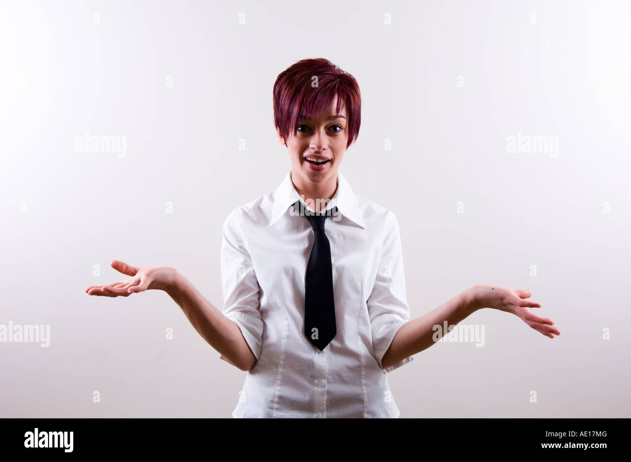 Confused Business woman with open arms Stock Photo - Alamy