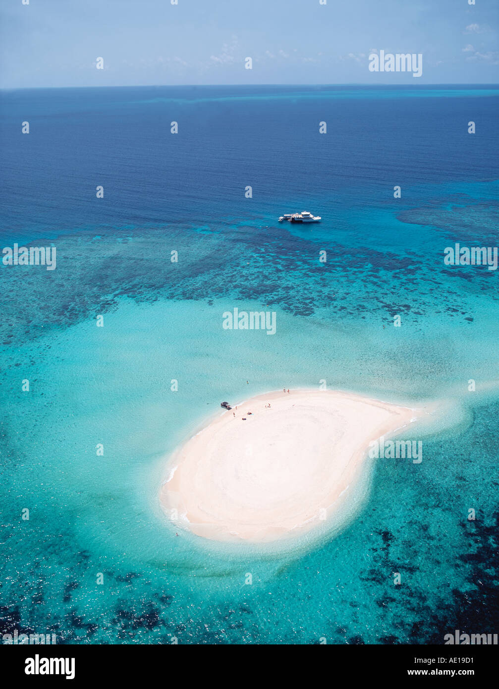 Aerial of tourist vessel visiting a coral sand cay on the Great Barrier ...