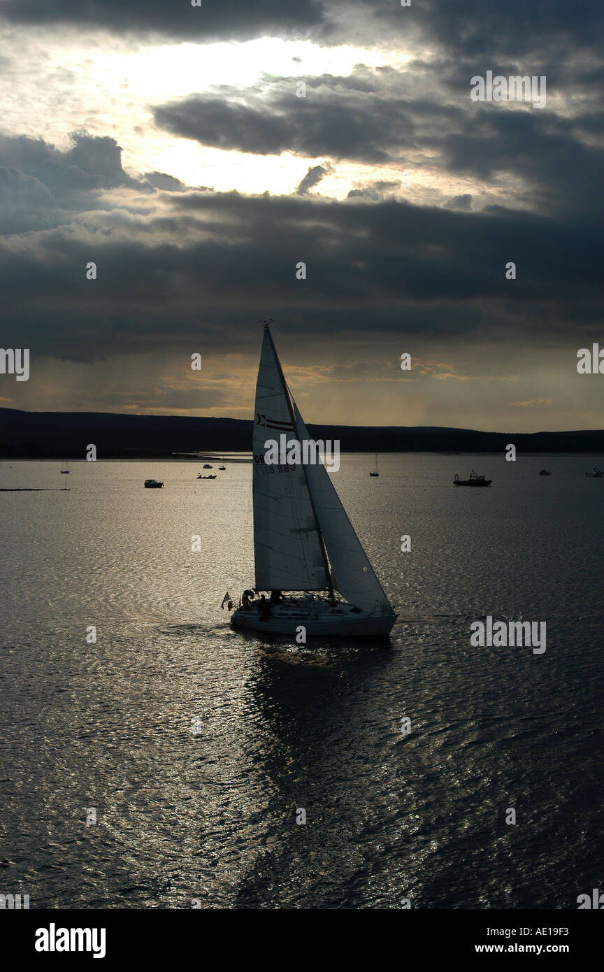Sailing into the sunset Stock Photo - Alamy