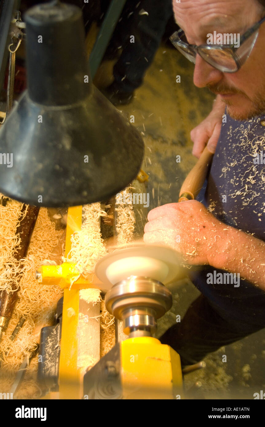 turning a wooden bowl on an electric powered woodturning lathe Stock ...