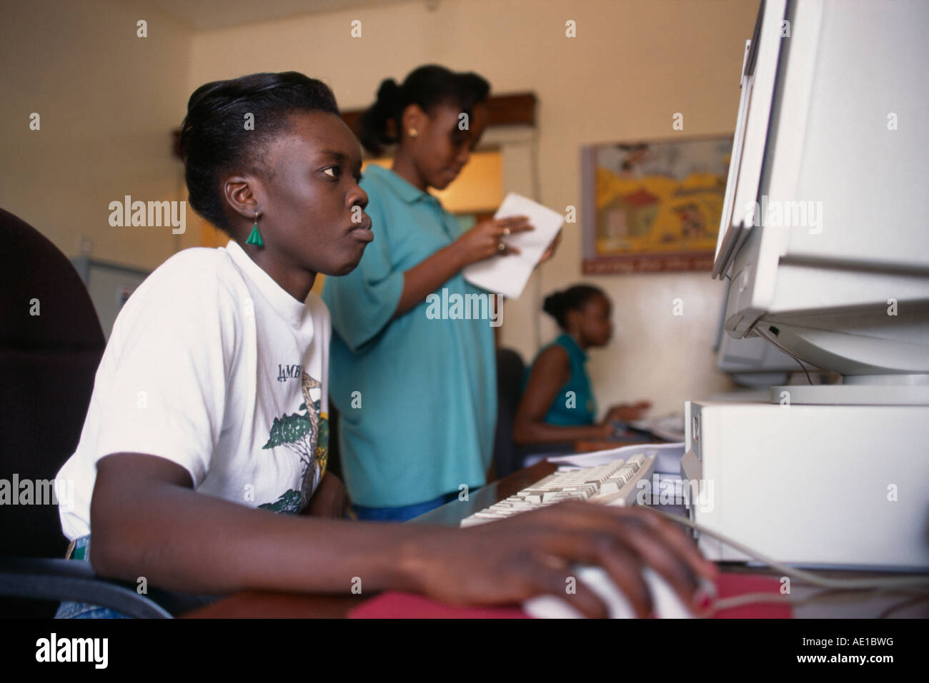 Uganda woman on computer hi-res stock photography and images - Alamy