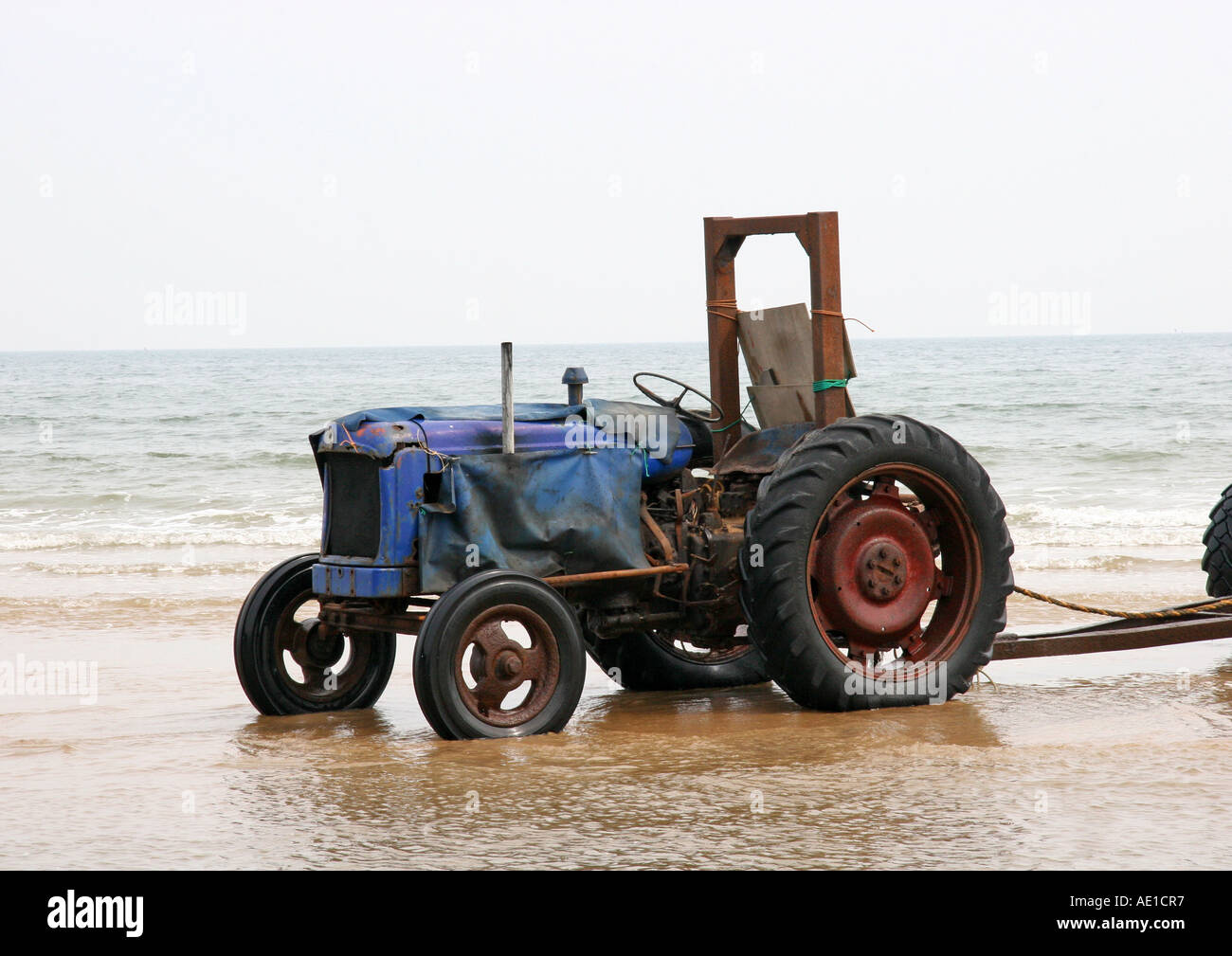 Sea tractor on wet beach hi-res stock photography and images - Alamy