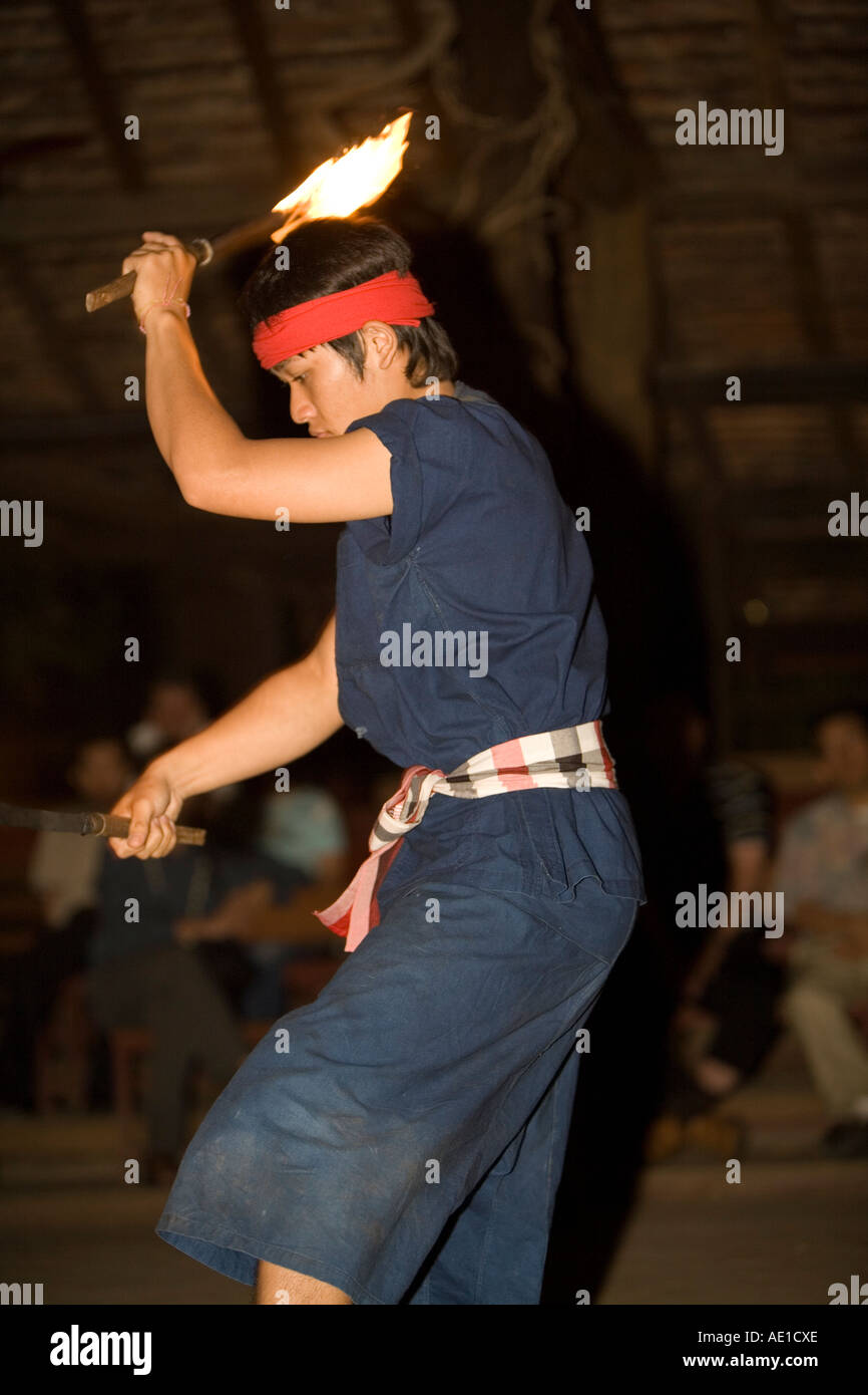 Thai boy dancing with fire sticks Stock Photo - Alamy