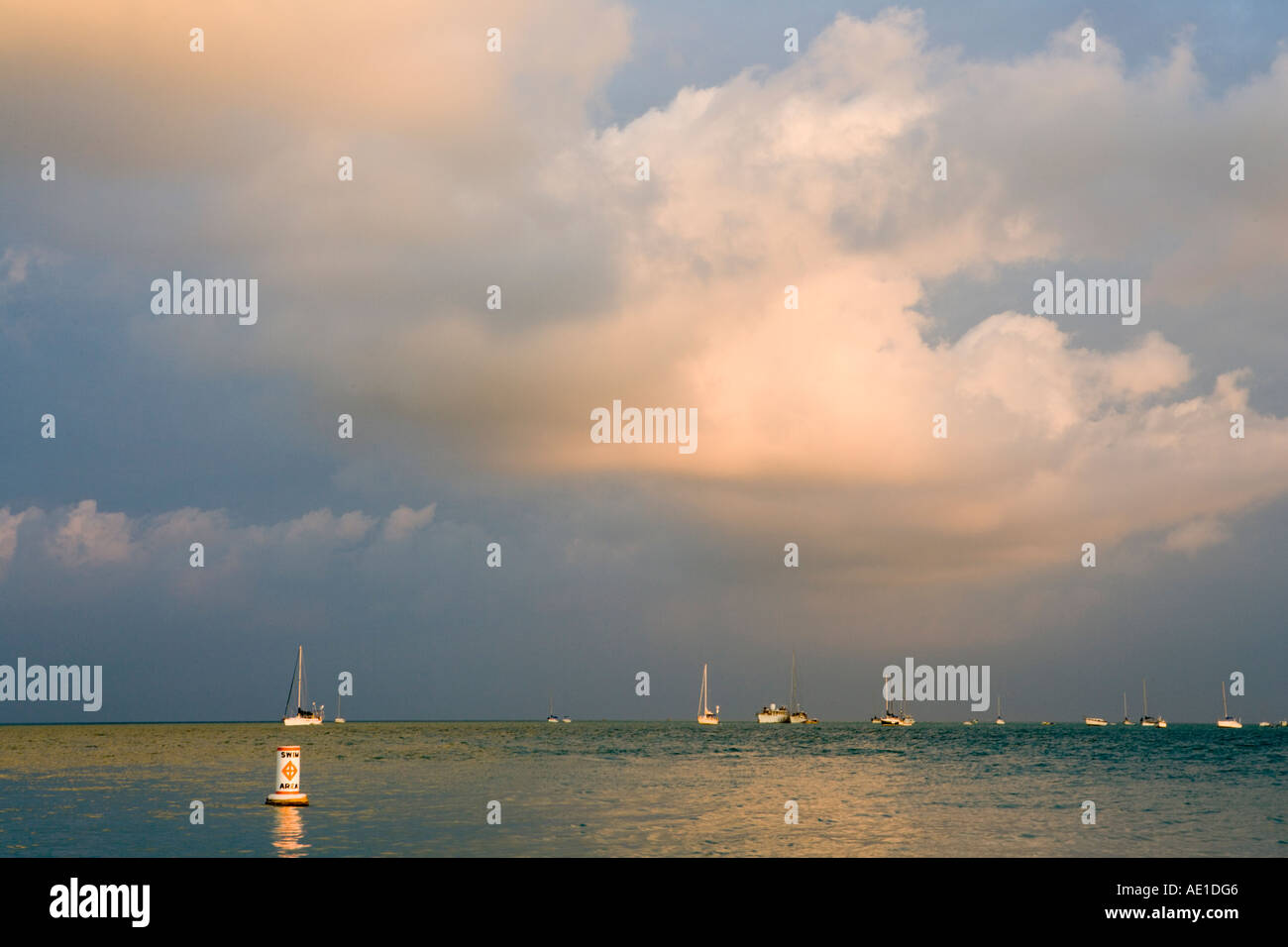 Sunrise view of boats and bouy off Sunset Key Florida US Stock Photo ...