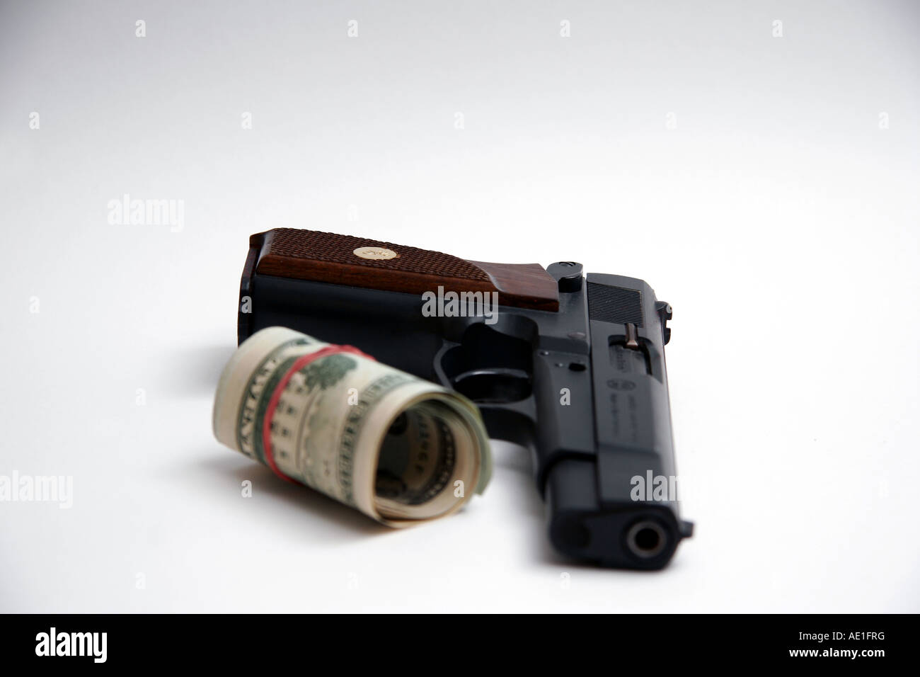 Gun and money Stock Photo - Alamy