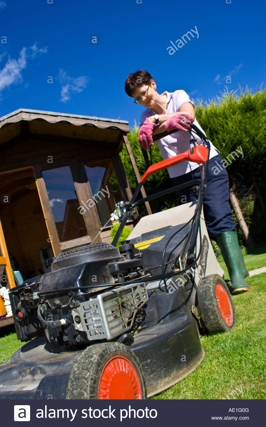 Woman Cutting The Grass High Resolution Stock Photography and Images - Alamy