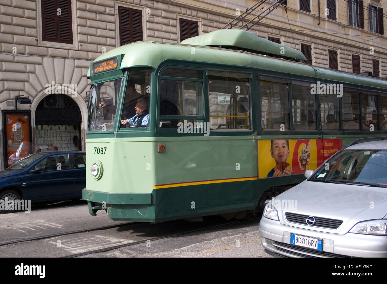 Green Tram car on tram lines Rome Street Italy Stock Photo - Alamy