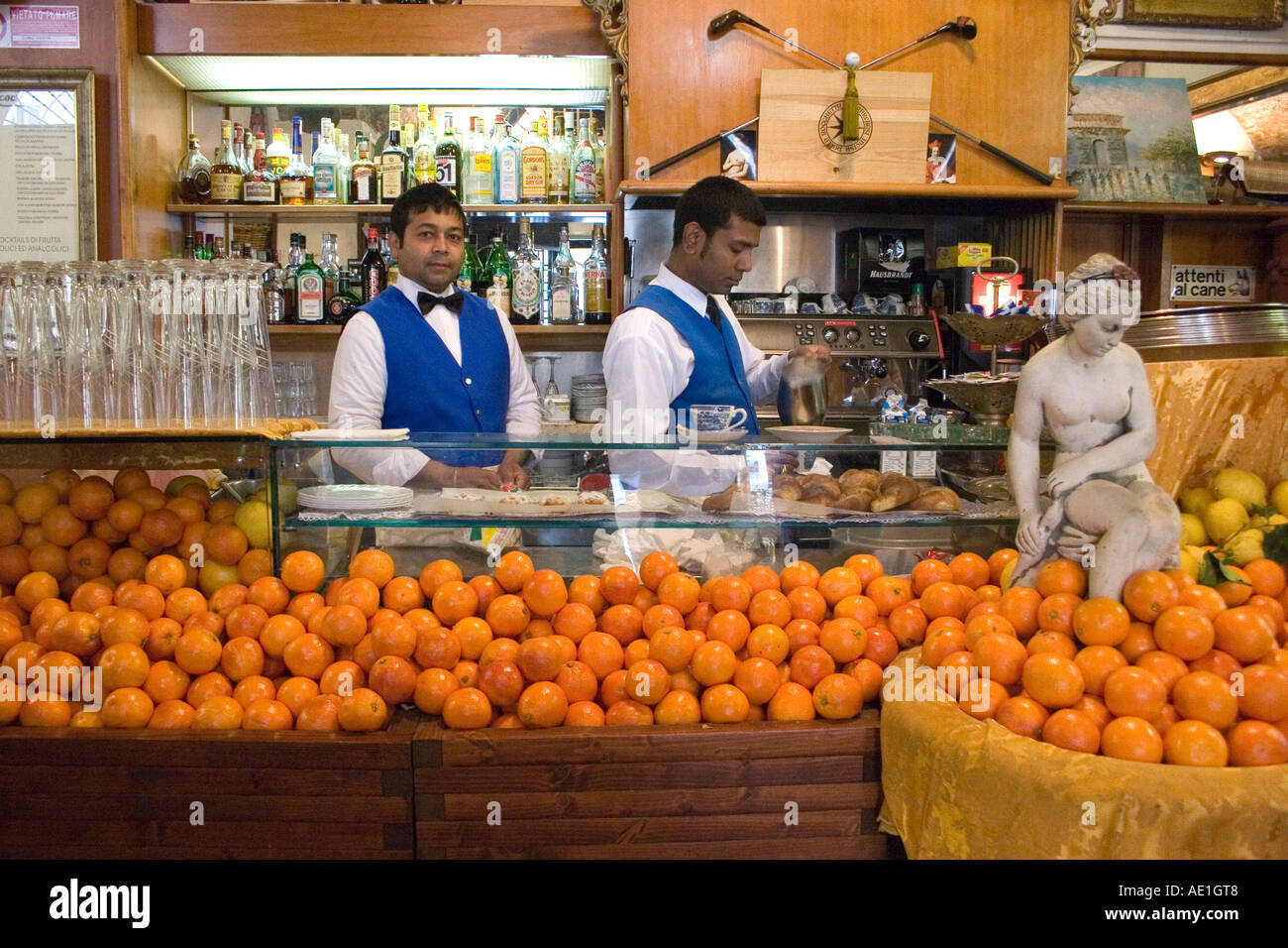 Cafe in Rome Italy with oranges and tuba muscial instrument Waiters in ...