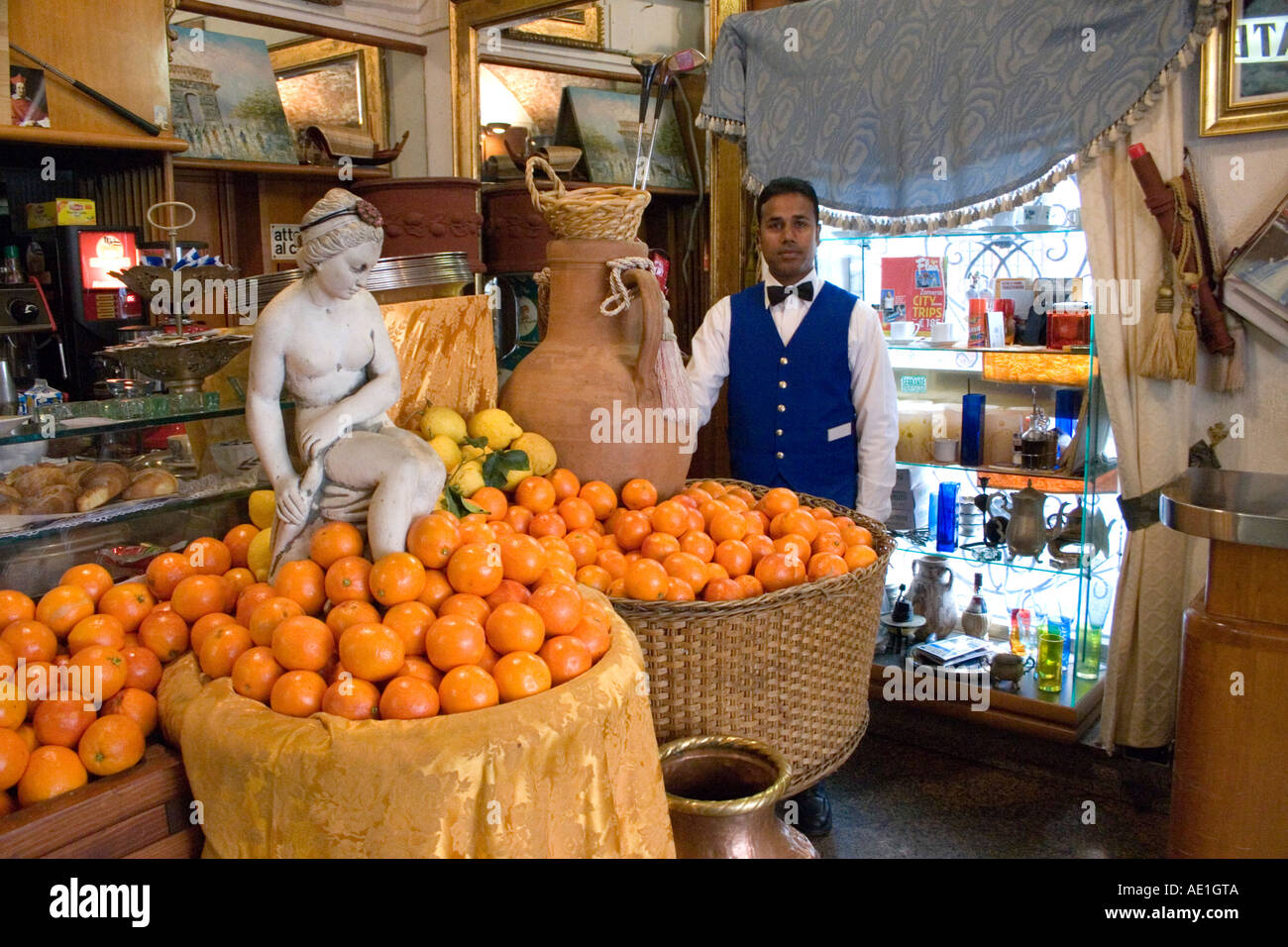 Cafe in Rome Italy with oranges and waiters in blue uniforms Stock ...