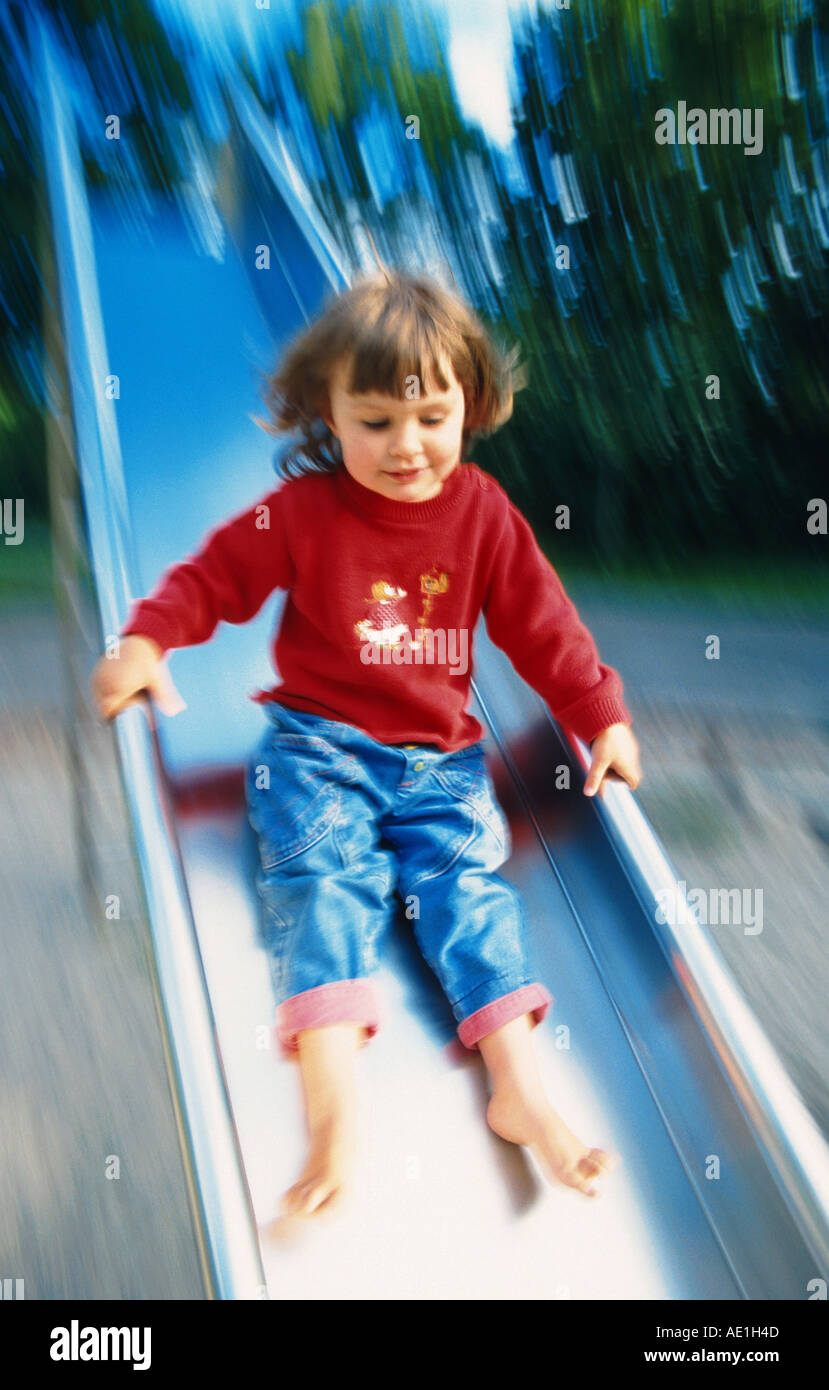 young girl on shute Stock Photo - Alamy