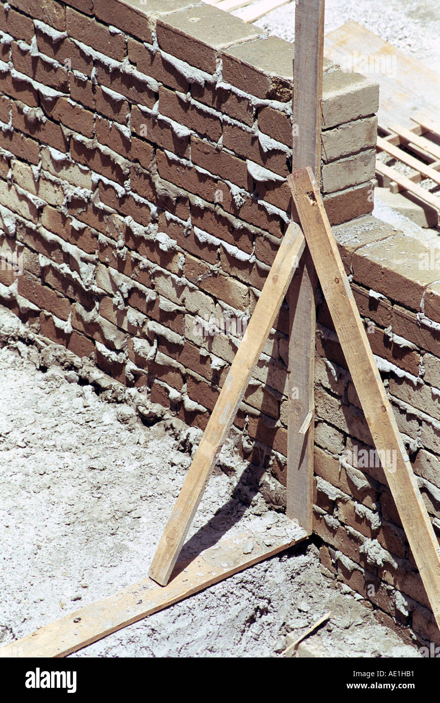 red brick wall under construction Stock Photo - Alamy