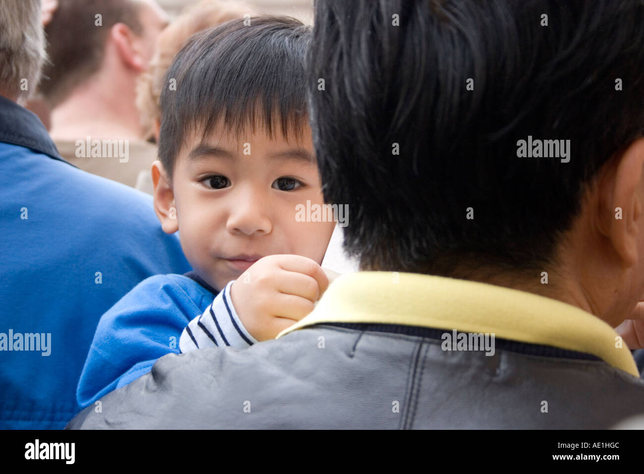 Small Japanese boy being carried by his father Stock Photo - Alamy