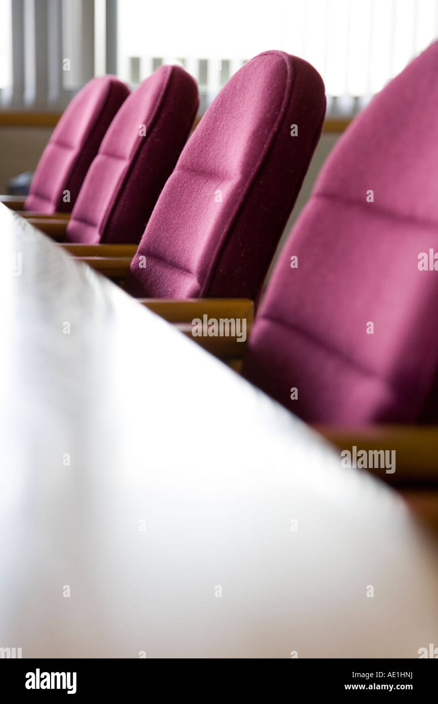 Boardroom table and chairs in a row Stock Photo - Alamy
