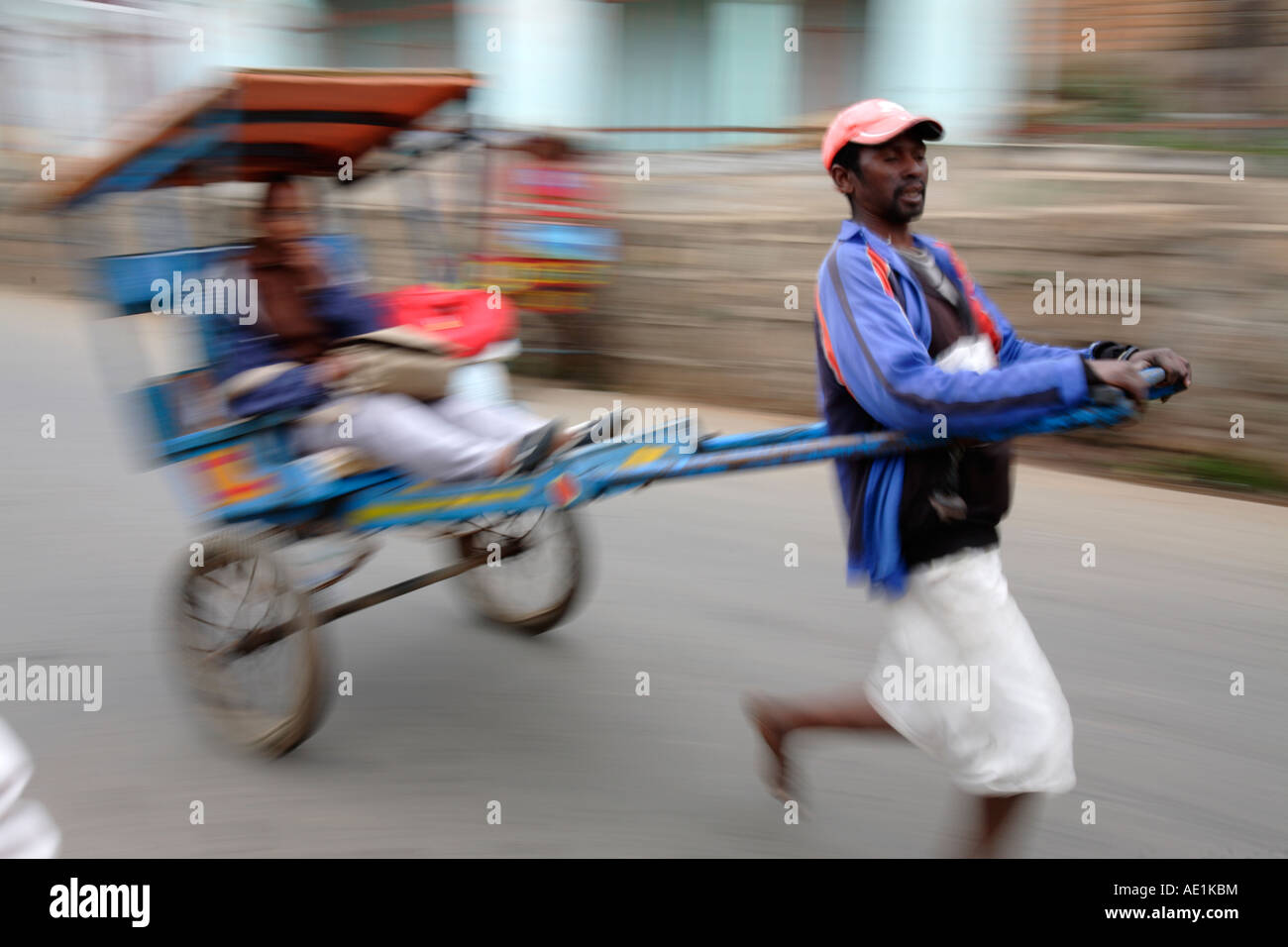 Traditional human powered rickshaw, Ambositra, Madagascar Stock Photo ...