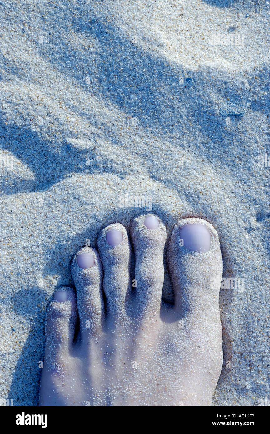 Foot and sand Stock Photo - Alamy