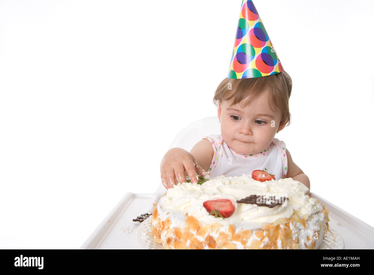 One year old baby girl eating from her birthday cake Stock Photo - Alamy