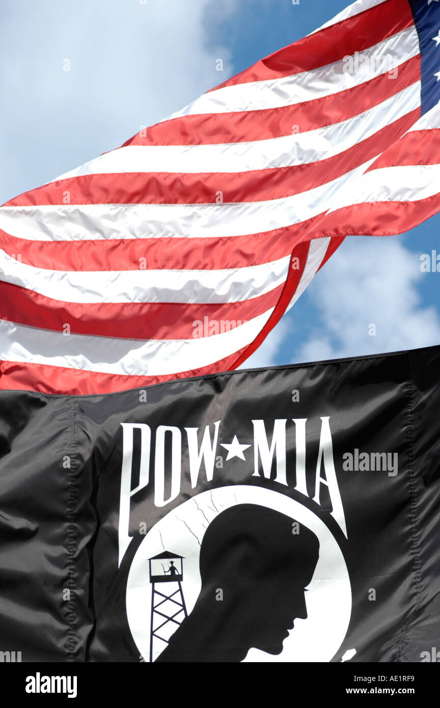 Prisoner of War flags and USA flag flying together front on building in ...