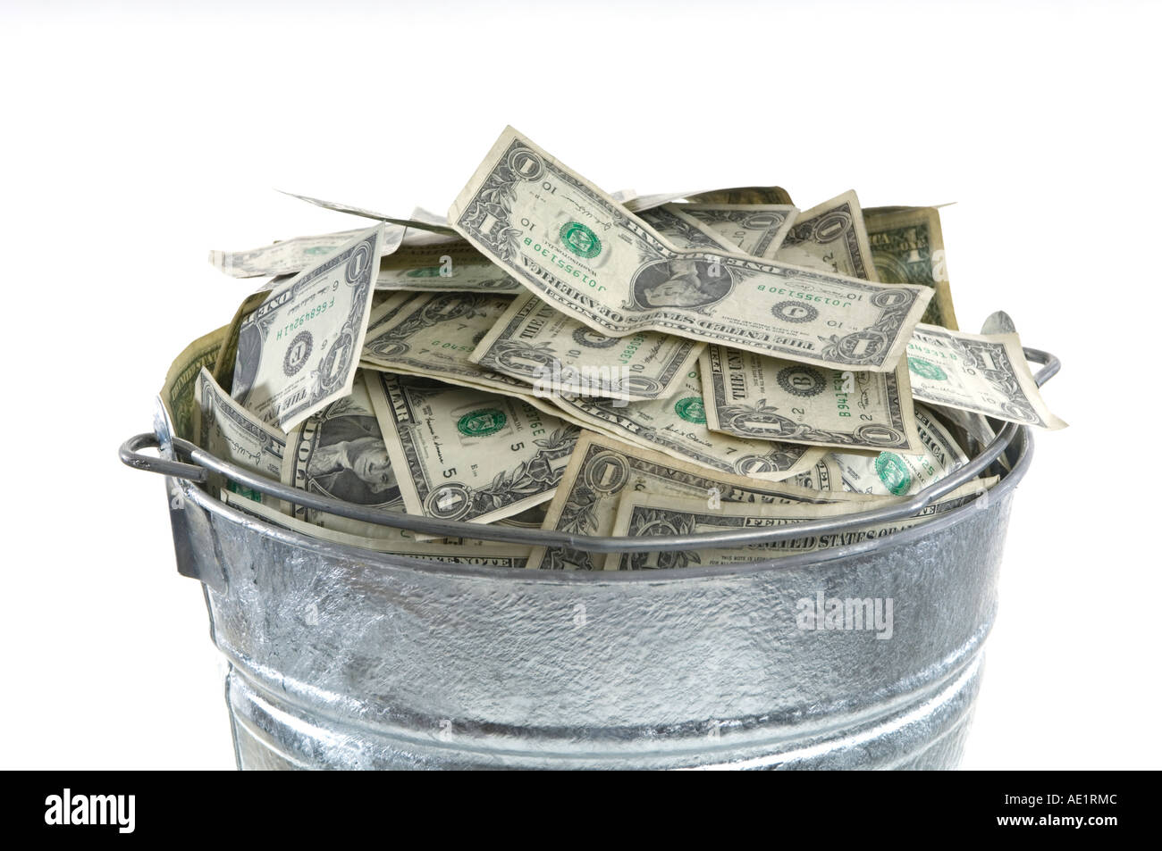 bucket full of money Stock Photo - Alamy