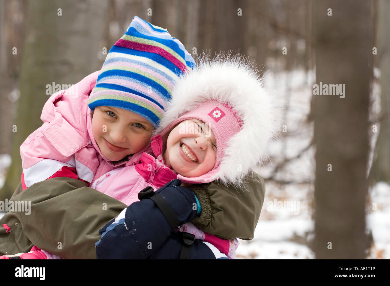 two children hug and smile Stock Photo - Alamy