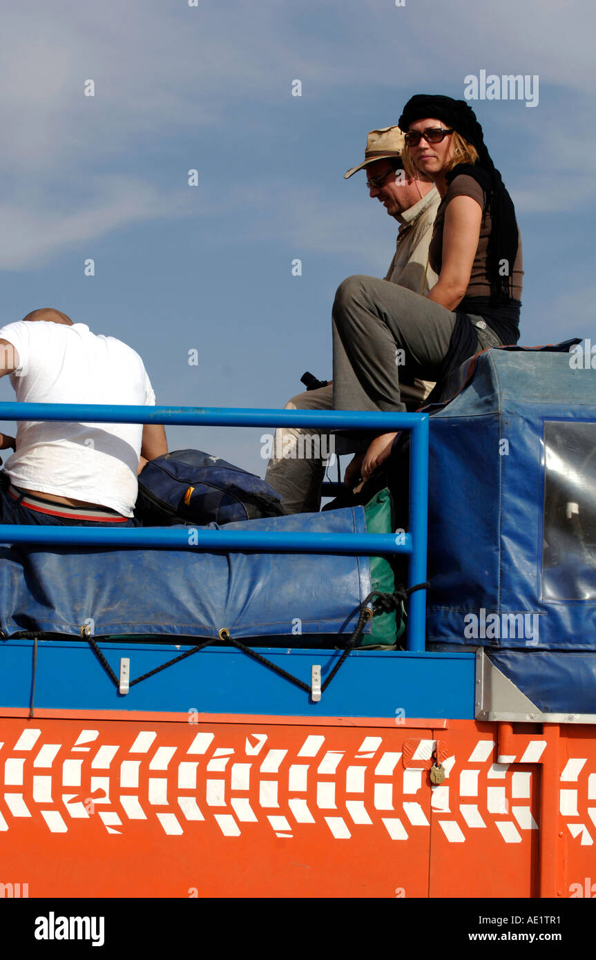 Travellers making their way through the tough terrain of the ...