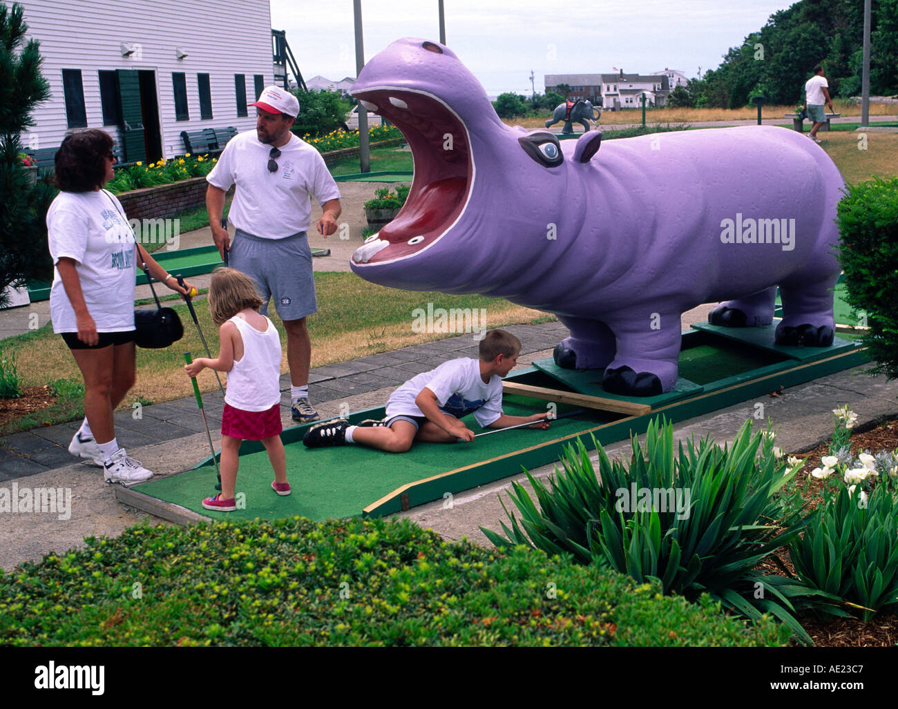 Family playing miniature golf, Cape Cod Stock Photo - Alamy