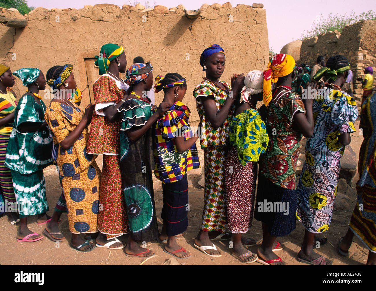Dogon men and women dance in procession during a village celebration ...