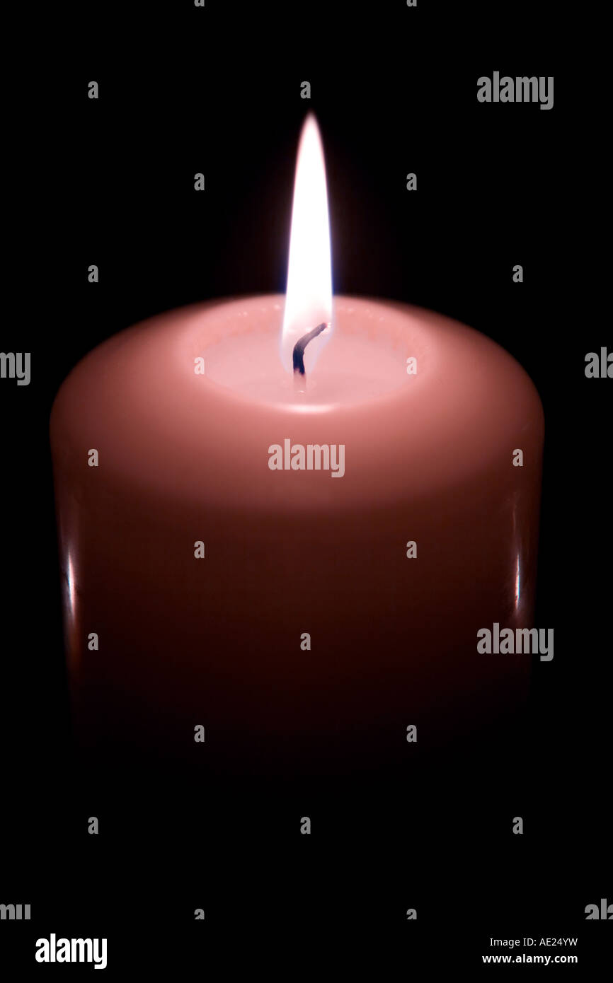 Wax candle and flame Stock Photo - Alamy