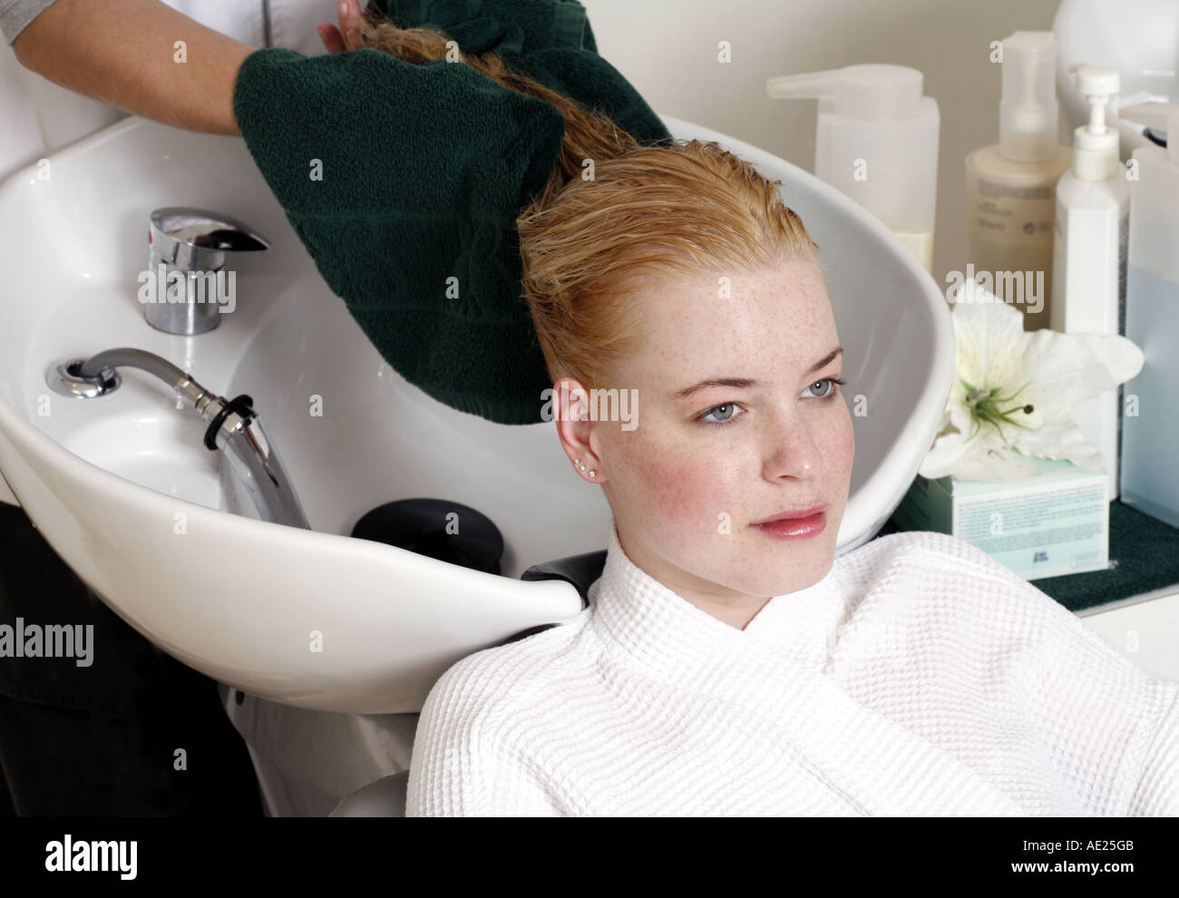Young woman having her hair washed at a salon Stock Photo - Alamy