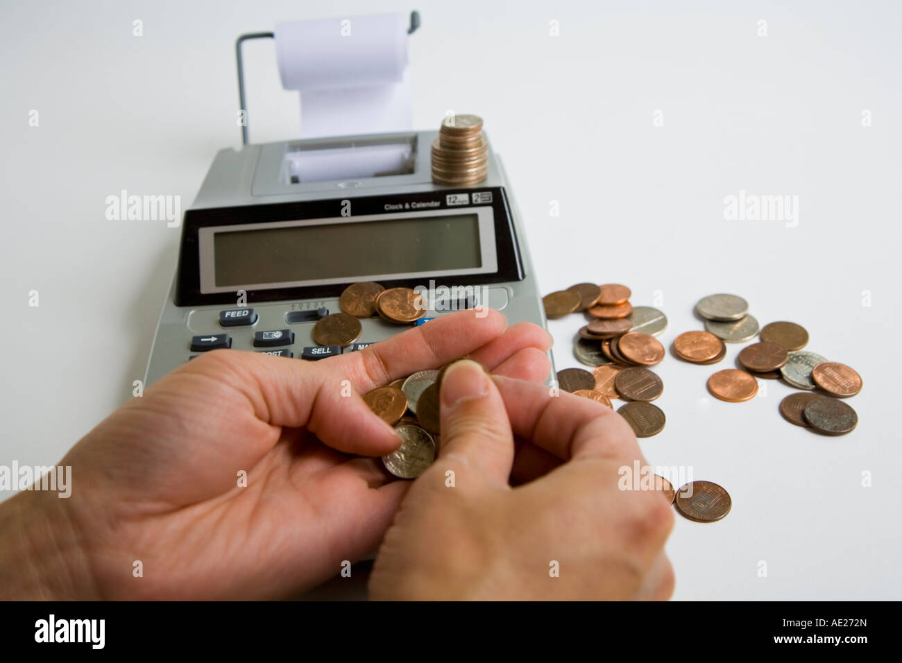 Counting Changes with Calculator Stock Photo - Alamy