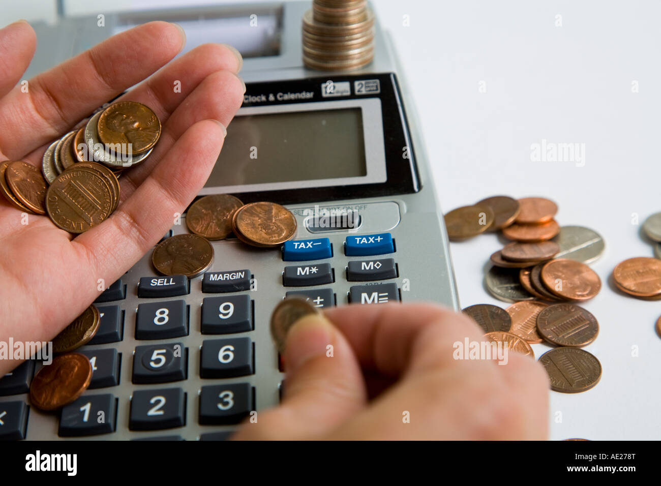 Counting Changes with Calculator Stock Photo - Alamy