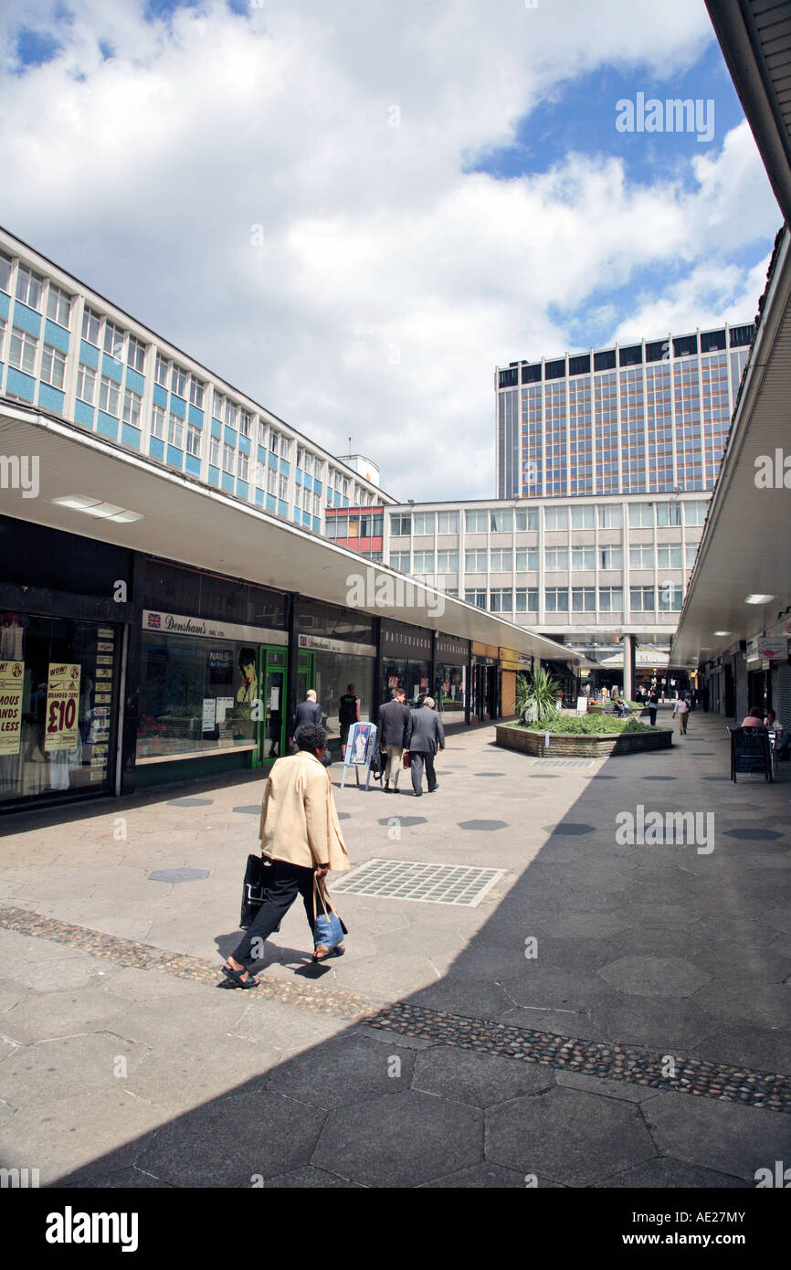 a man walks through a concrete shopping mall in woking, england Stock ...