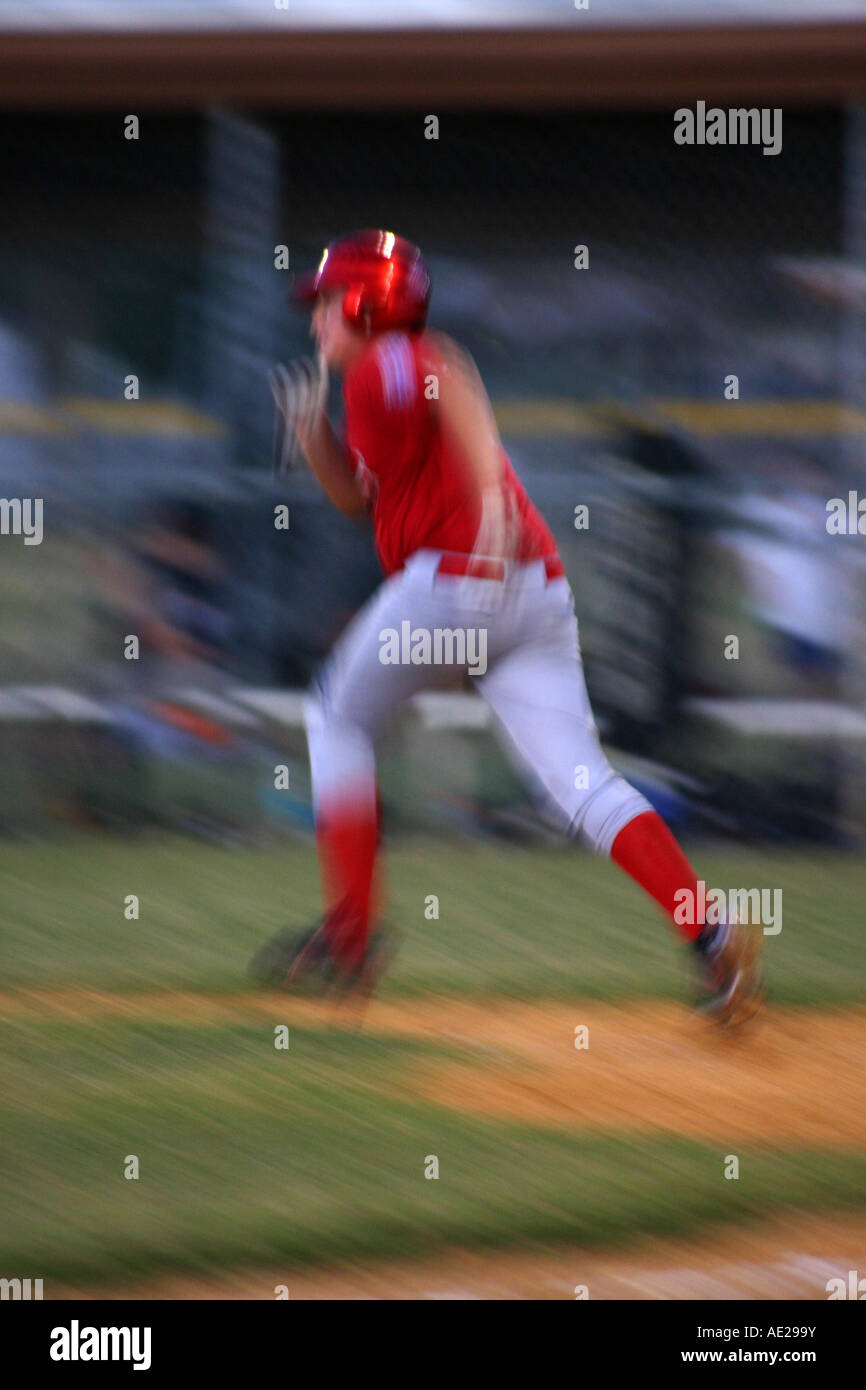 Little League Baseball Player Running to First Base Stock Photo - Alamy