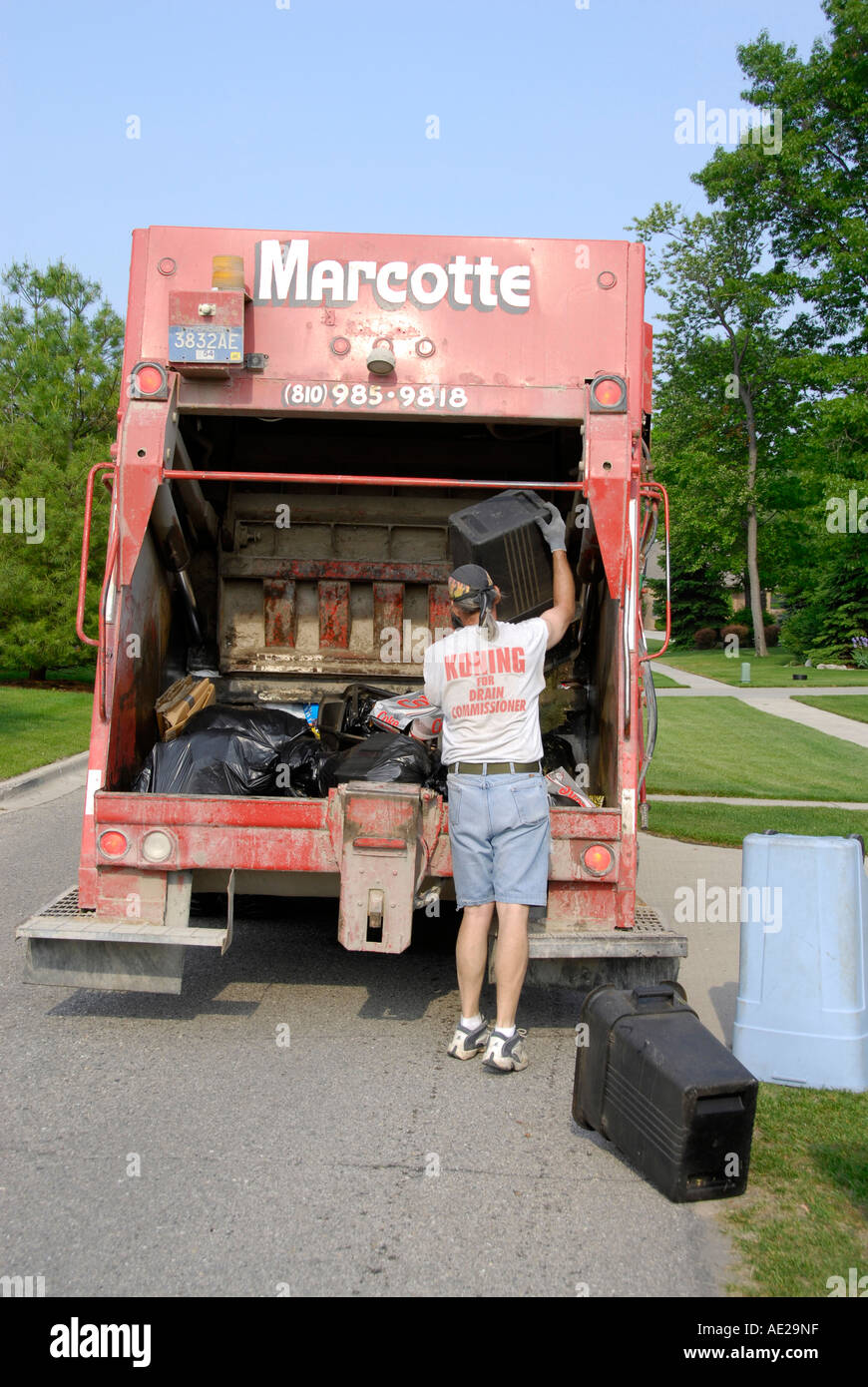 Residential trash collection crew pick up waste products Stock Photo ...