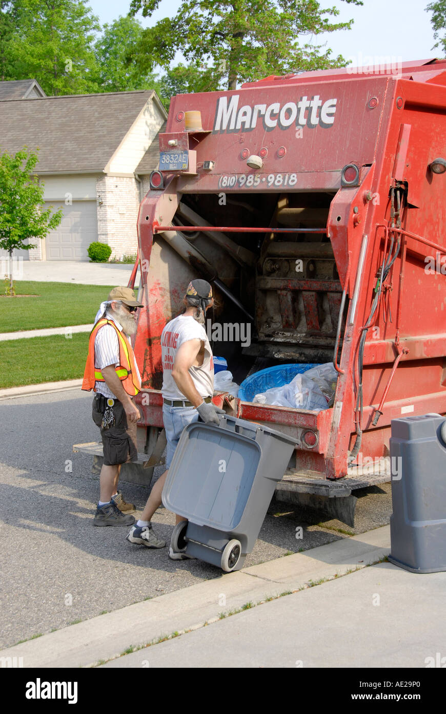 Residential trash collection crew pick up waste products Stock Photo ...