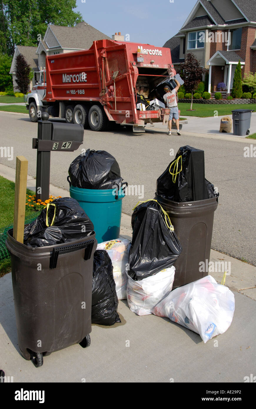 Residential trash collection crew pick up waste products Stock Photo ...