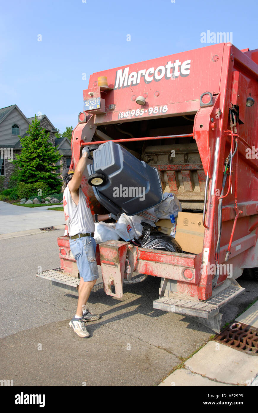 Residential trash collection crew pick up waste products Stock Photo ...