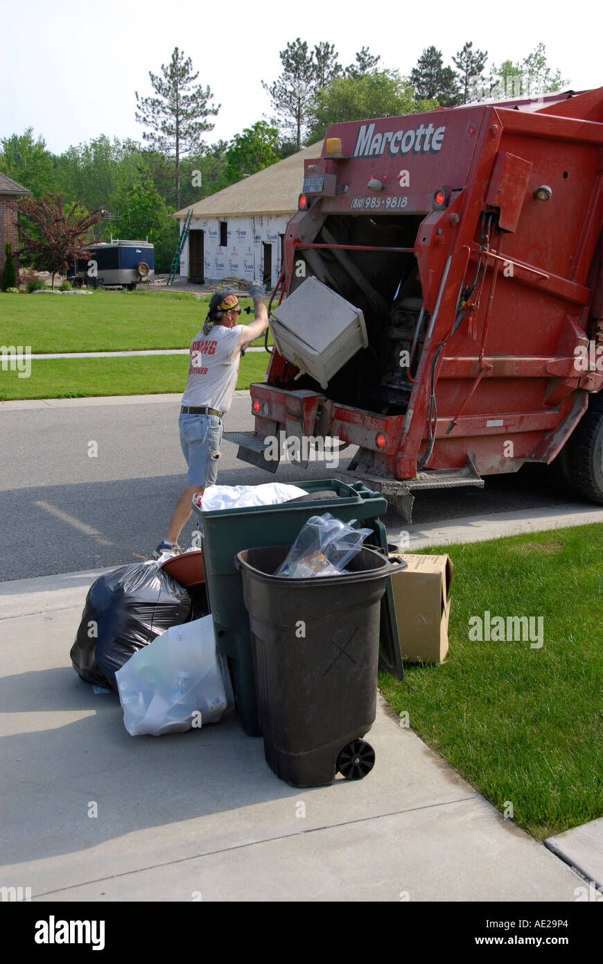 Residential trash collection crew pick up waste products Stock Photo ...