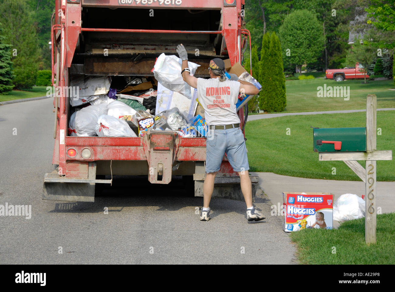 Residential trash collection crew pick up waste products Stock Photo ...