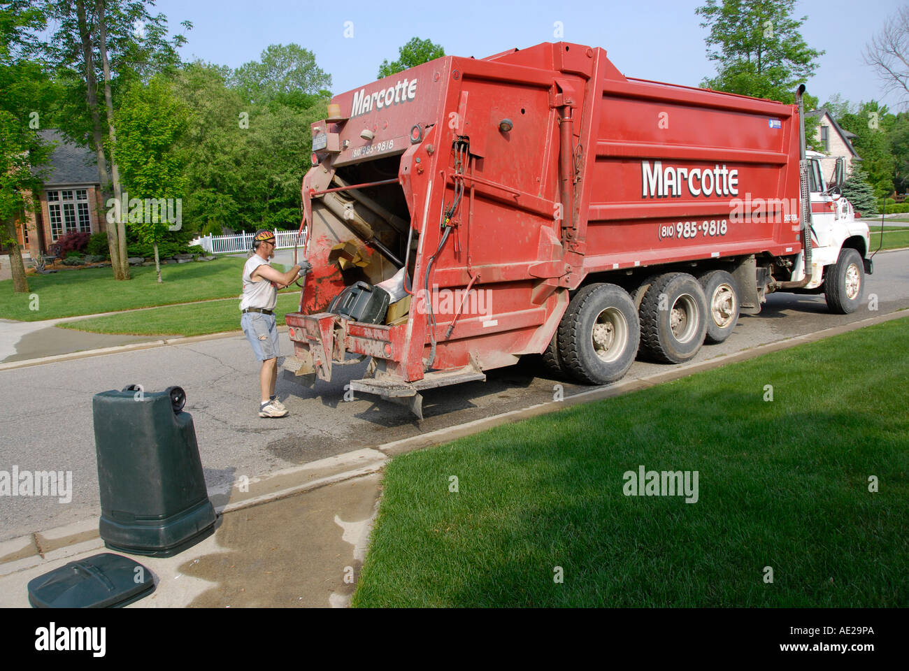 Residential trash collection crew pick up waste products Stock Photo ...