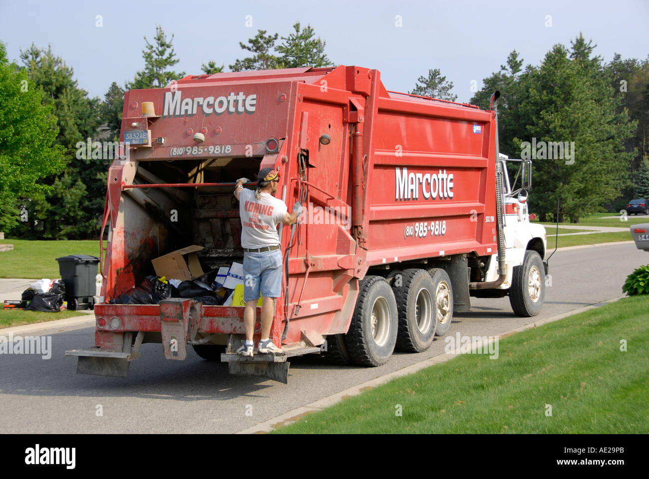 Residential trash collection crew pick up waste products Stock Photo ...