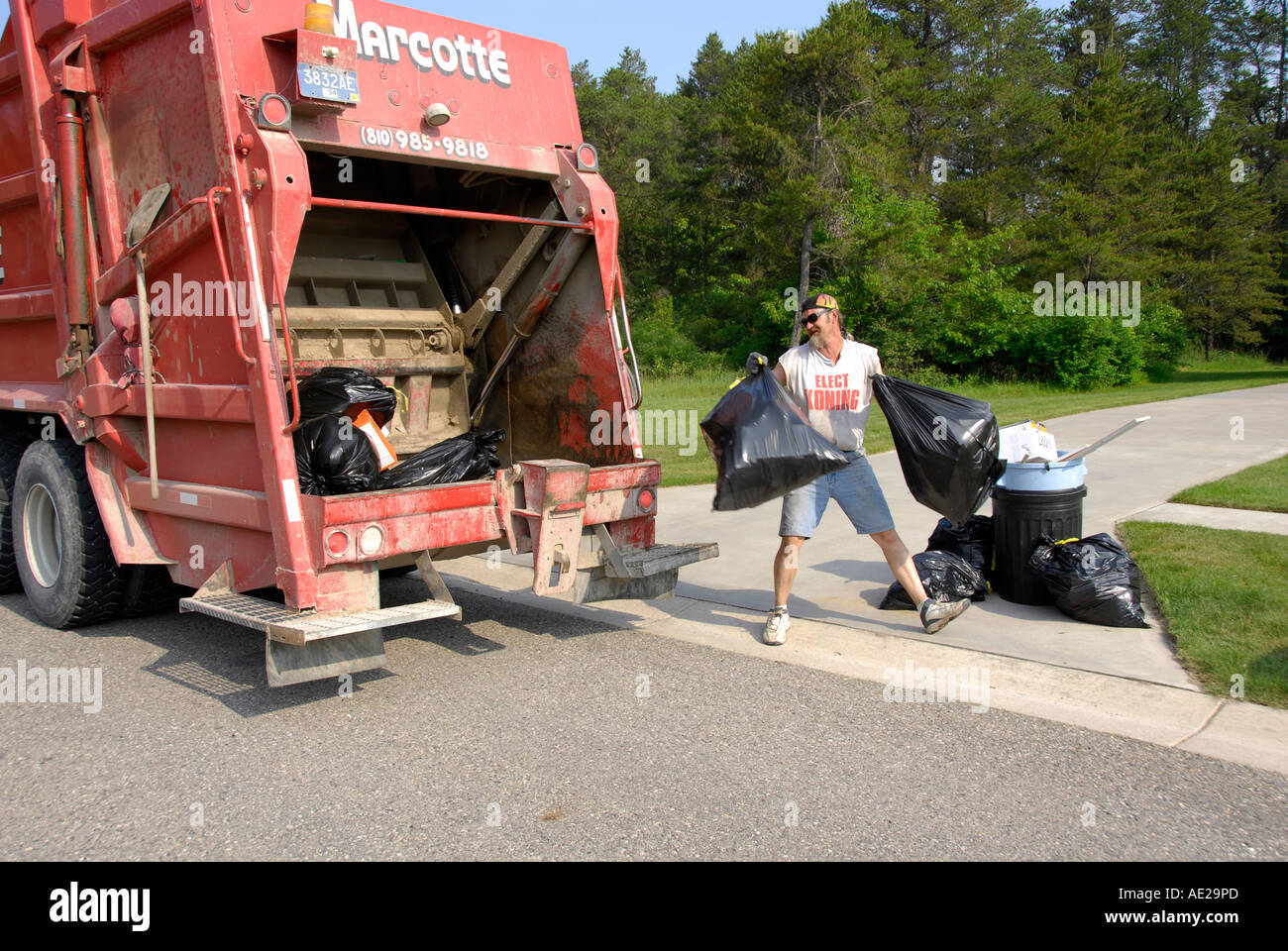 Residential trash collection crew pick up waste products Stock Photo ...